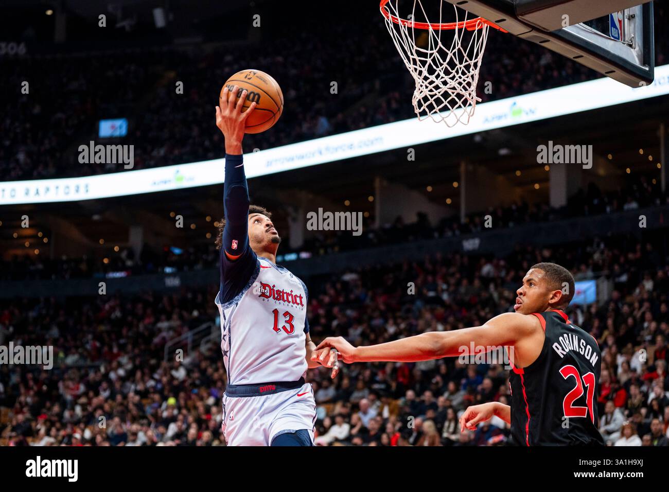 Toronto, Canada. 08th Mar, 2025. Washington Wizards guard Jordan Poole (13) lays up the ball ...