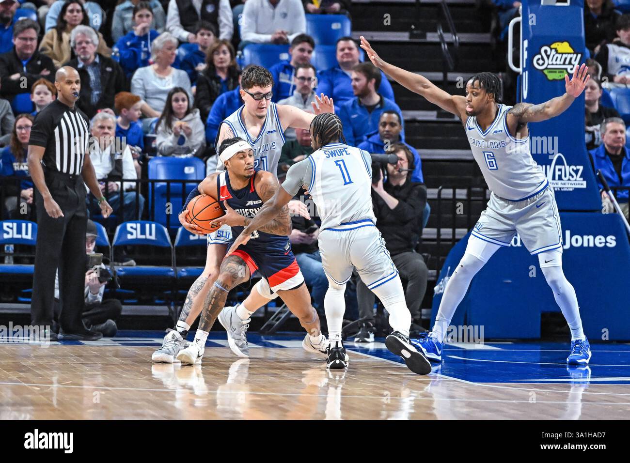 MARCH 08, 2025: Duquesne Dukes guard Tre Dinkins (0) tries to get away ...