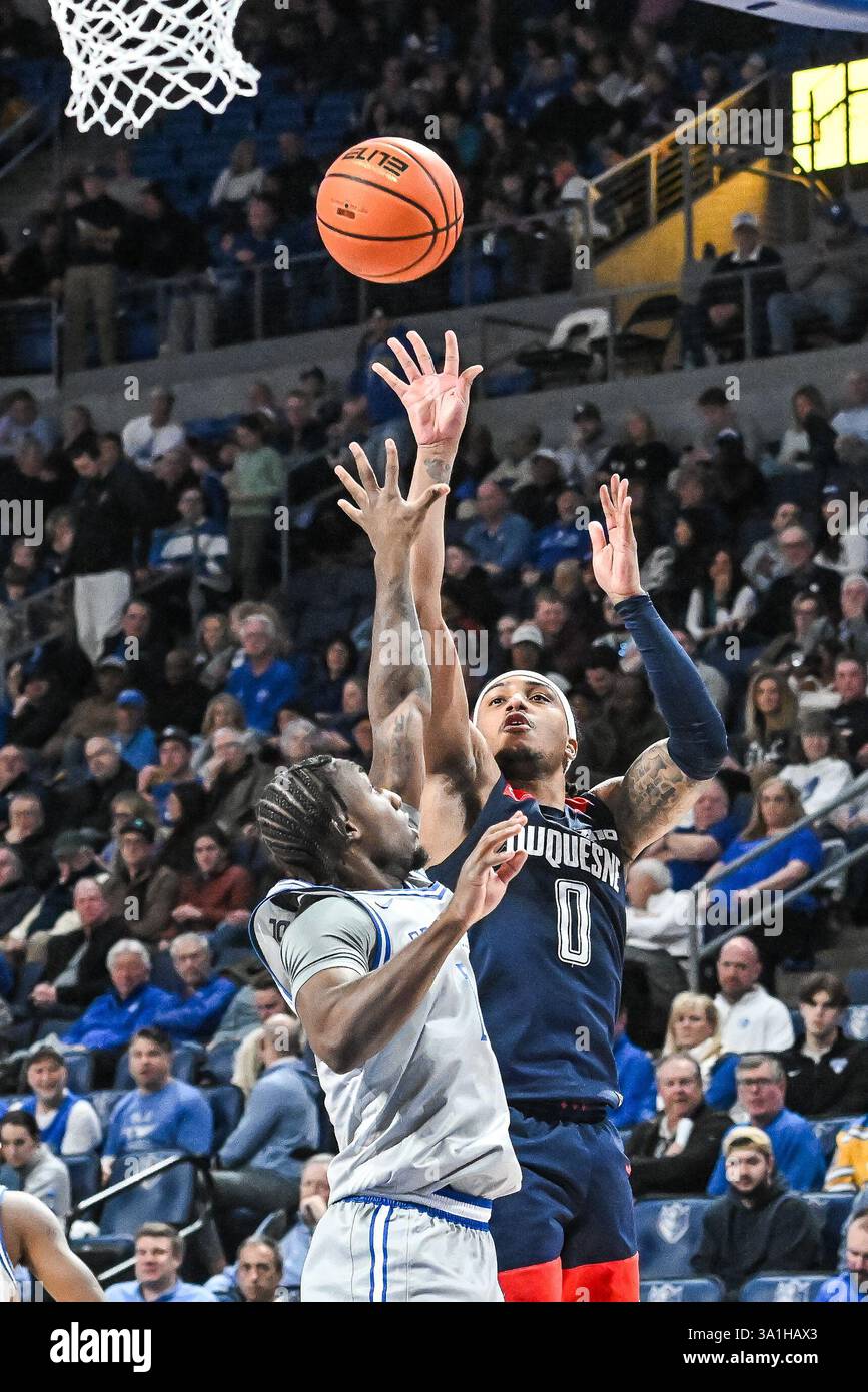 MARCH 08, 2025: Duquesne Dukes guard Tre Dinkins (0) tosses up a shot ...