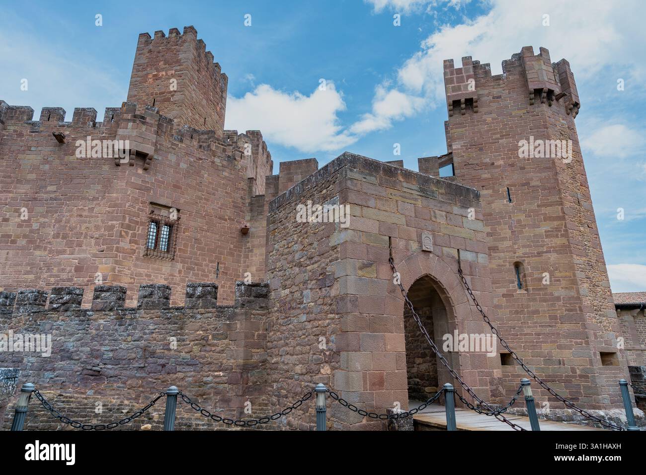 Medieval castle on a sunny day with blue sky and clouds Stock Photo - Alamy