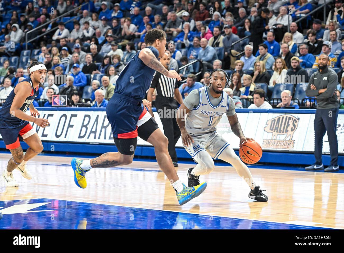 MARCH 08, 2025: Duquesne Dukes forward Eli Wilborn (25) tries to cut ...