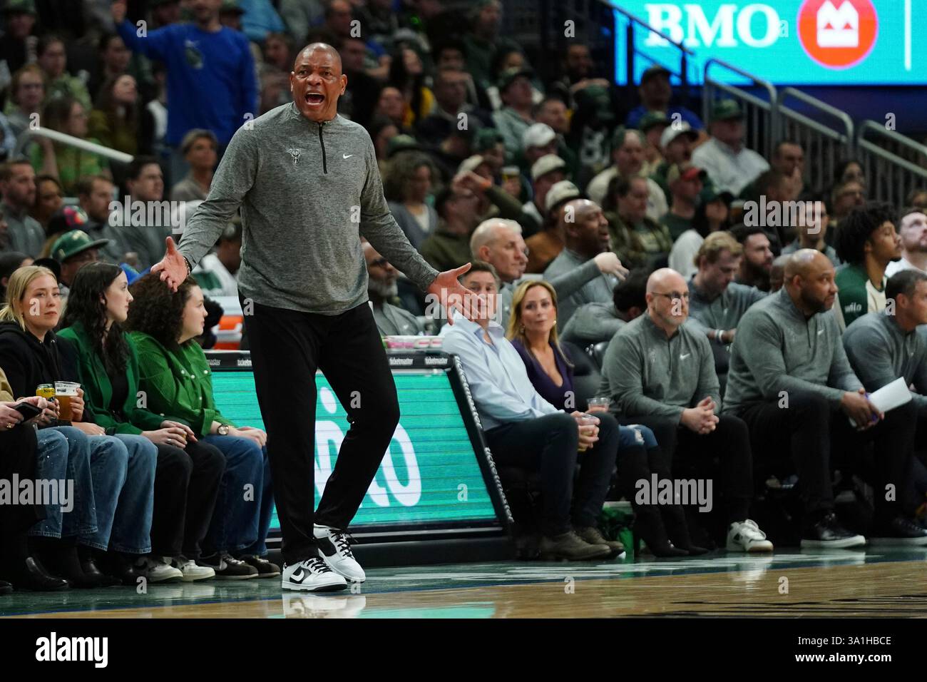 Milwaukee Bucks head coach Doc Rivers, front, reacts from the sideline ...