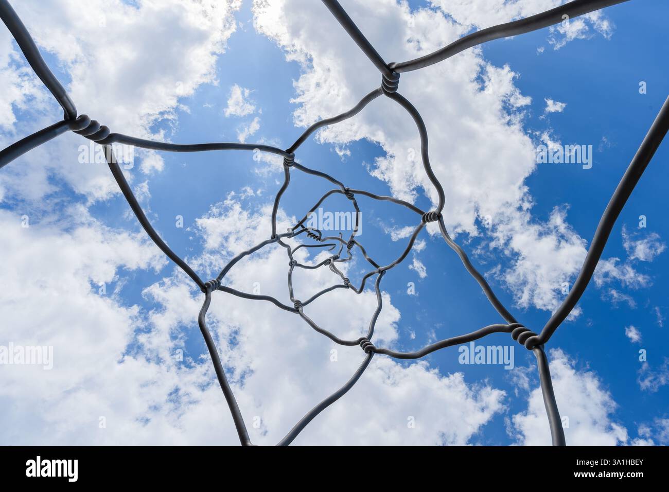 A net traps the sky, the sun, and the clouds as a concept of the ...