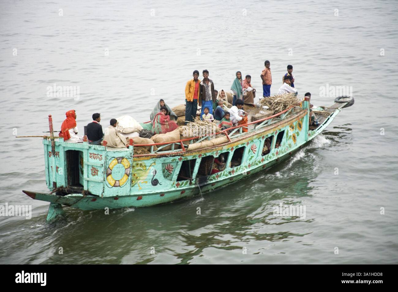 People traveling in boat in Burigunga Buri Gunga River, Sadarghat Boat terminal, Dhaka ...