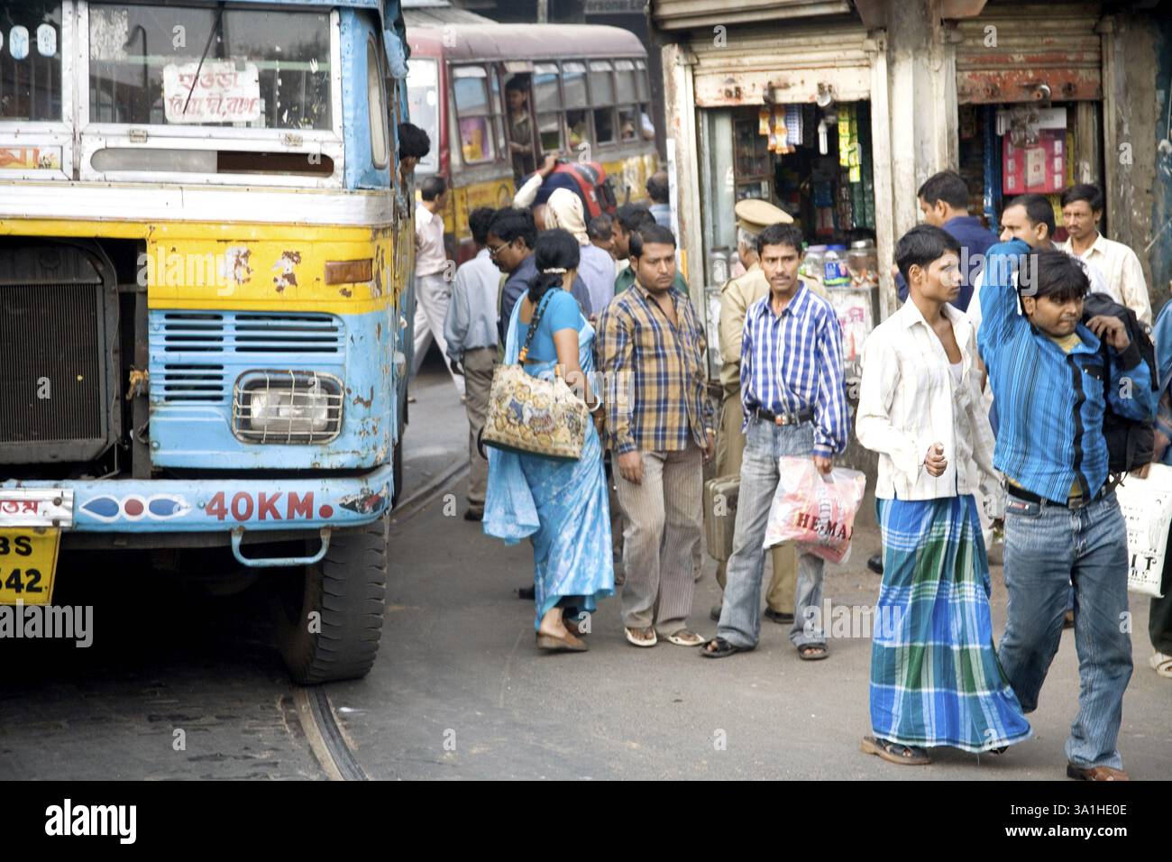 Street scene, people and bus on road, Calcutta now Kolkata, West Bengal ...