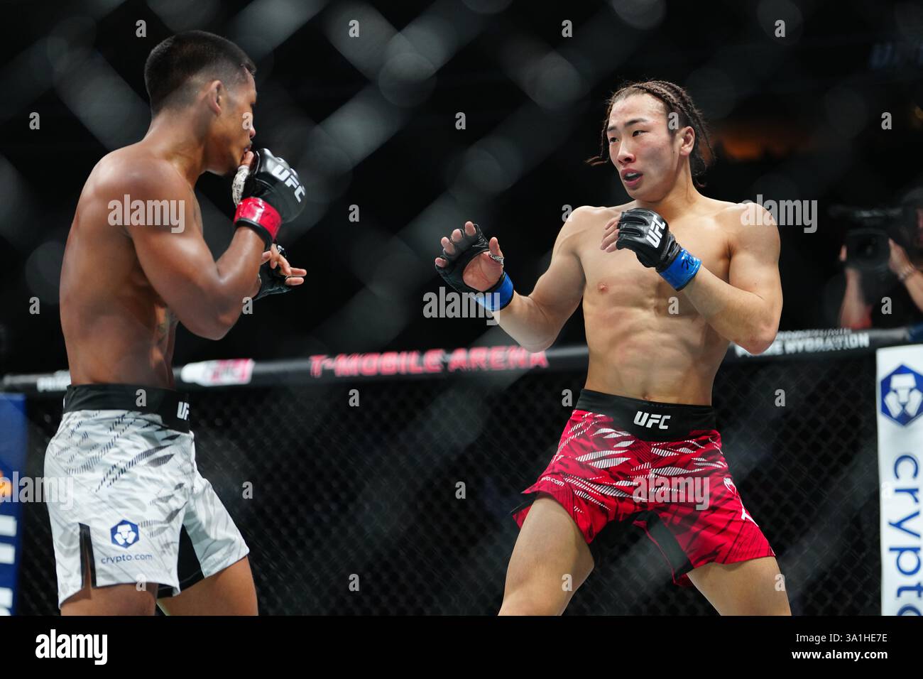 LAS VEGAS, NV - MARCH 8:Joshua Van and Rei Tsuruya meet in the octagon ...