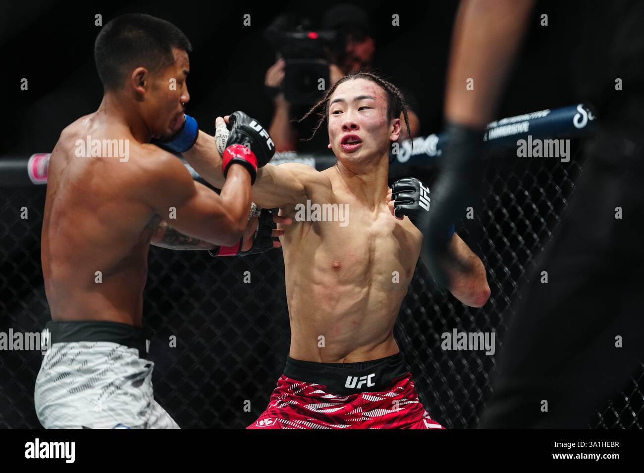 LAS VEGAS, NV - MARCH 8:Joshua Van and Rei Tsuruya meet in the octagon ...