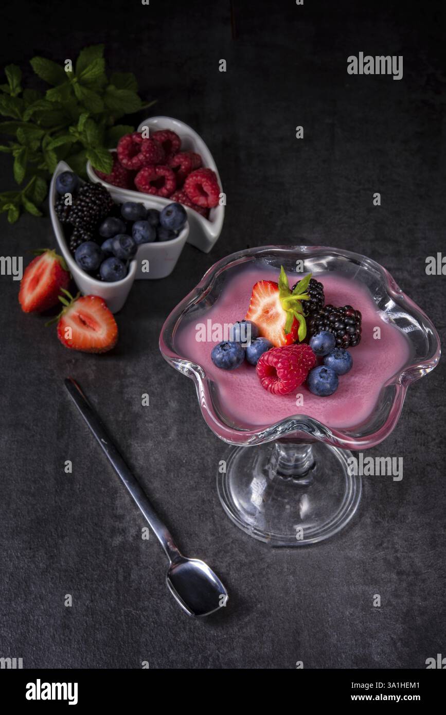 Delicious pudding with wild berry Stock Photo - Alamy