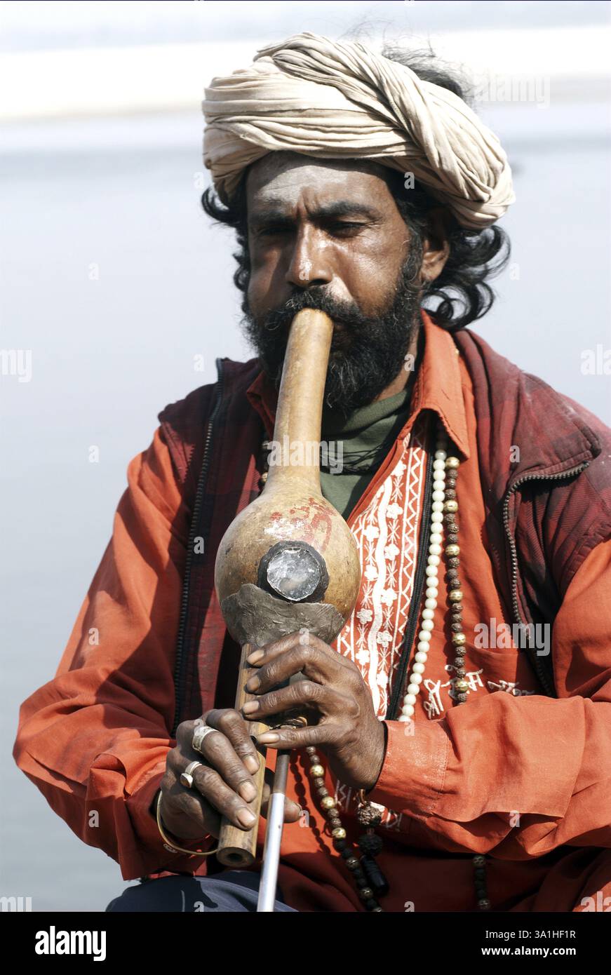 A snake charmer with his musical instrument at Varanasi, or banaras ...