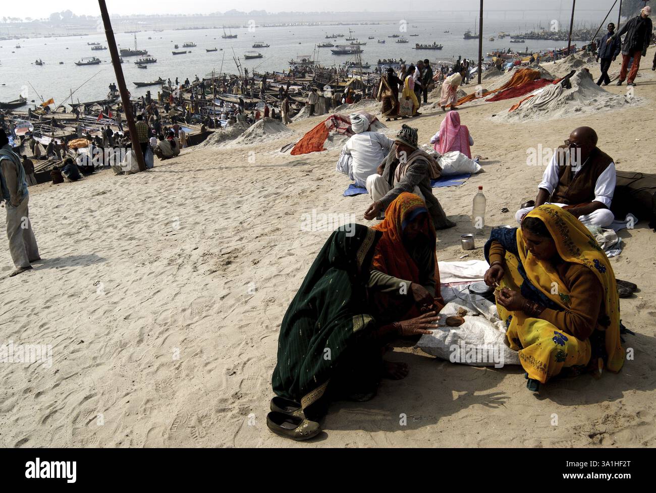 Pilgrims or devotees have lunch together at the confluence of the ...