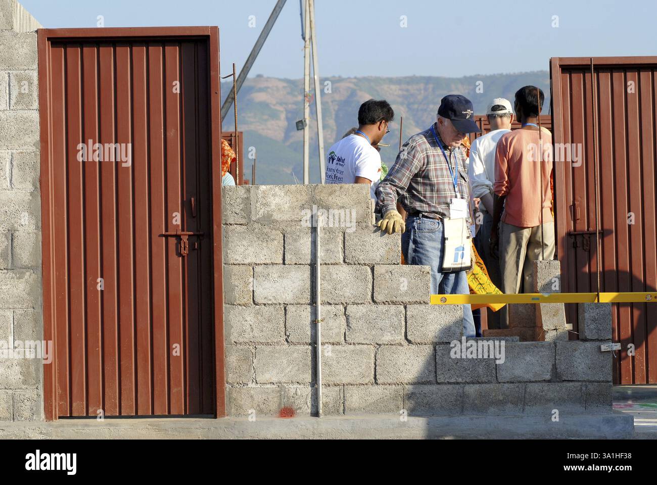 Former US president Jimmy Carter along with volunteers build houses at ...