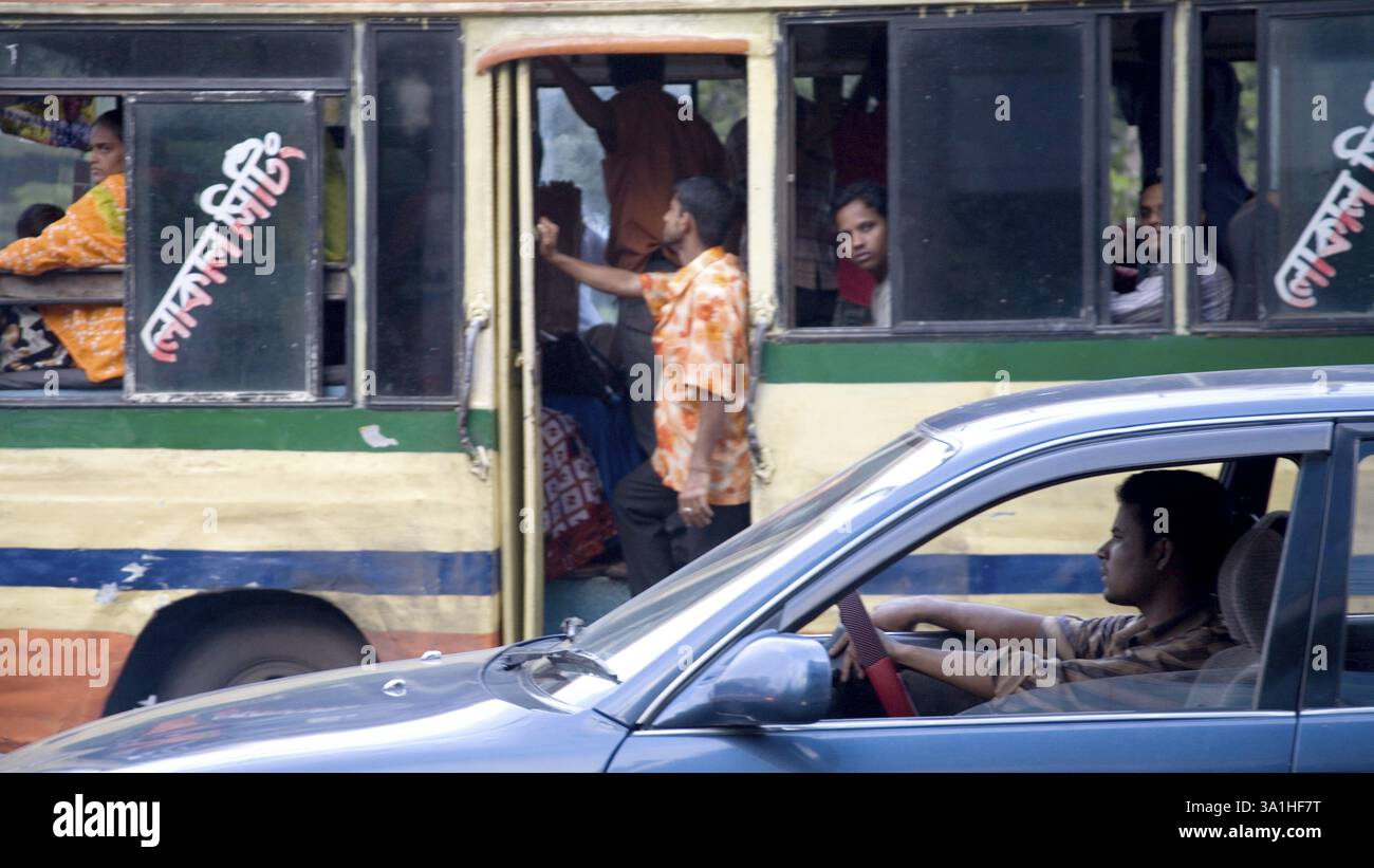 Street scene, car and local bus on road traffic in Dhaka, Bangladesh ...