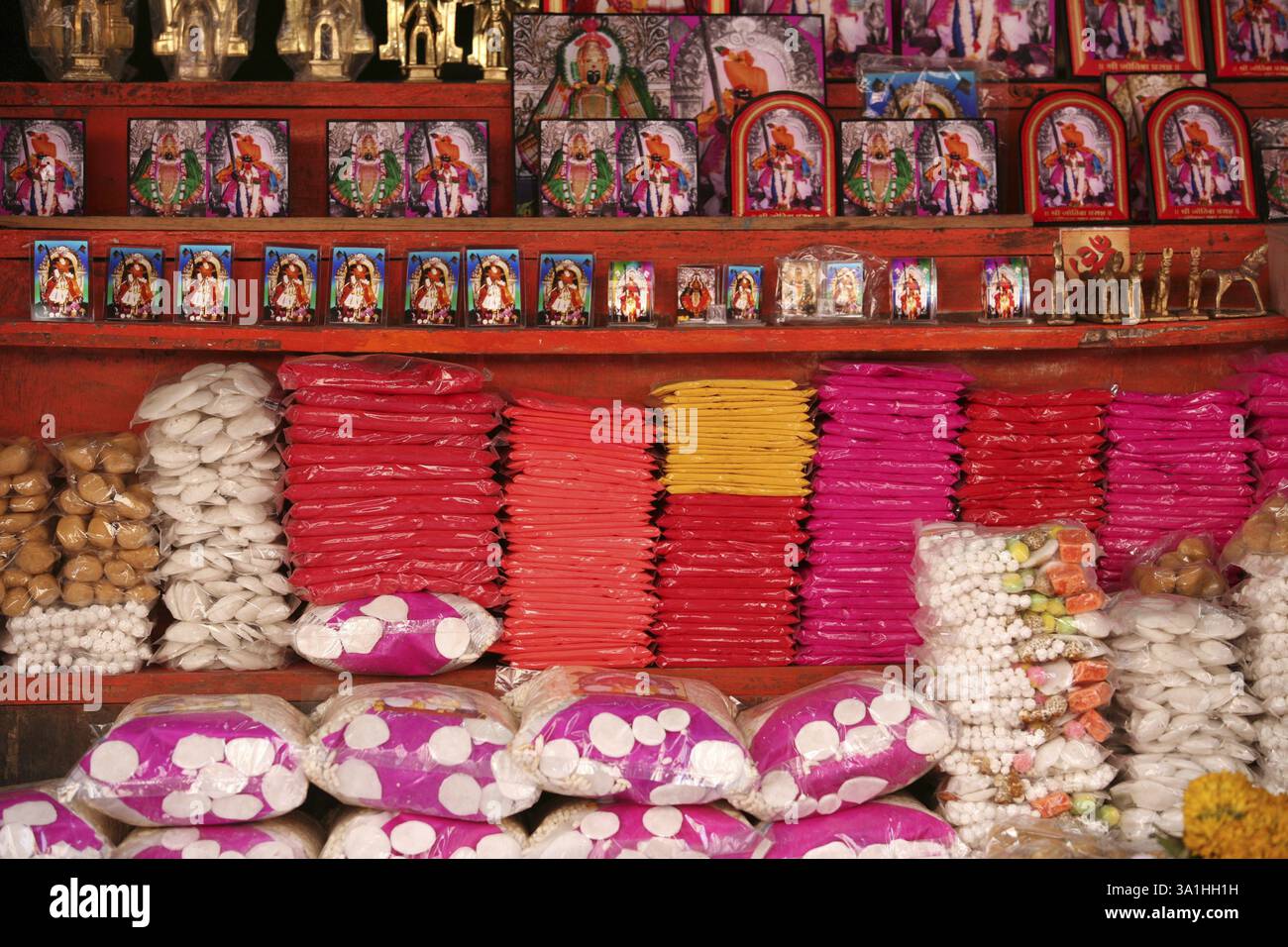 The gulal or pink powder packets and sweets packets at Jotiba temple in ...