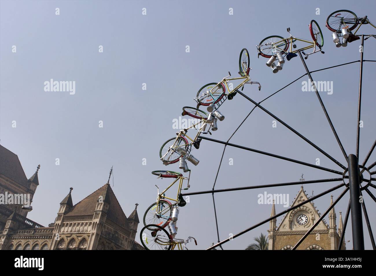 A giant wheel installation made up with bicycles carrying tiffin boxes ...