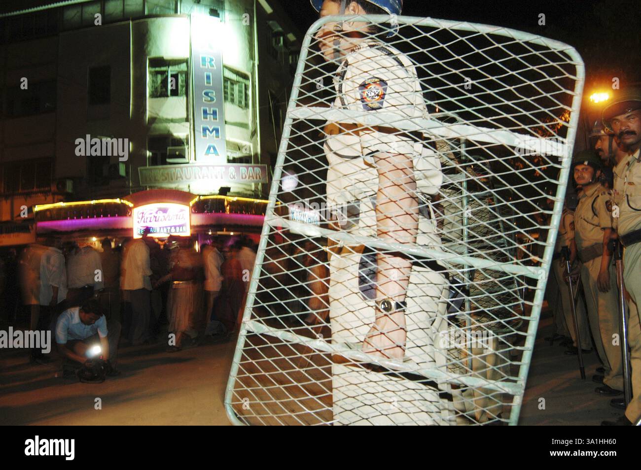 Riot police stand guard to prevent and untoward incident, Bombay now ...