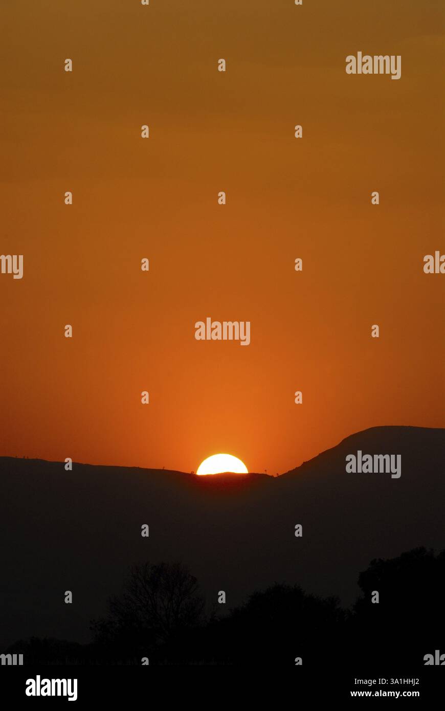 Colorful sunset behind mountain of Sahyadri ranges at Otur, Taluka ...
