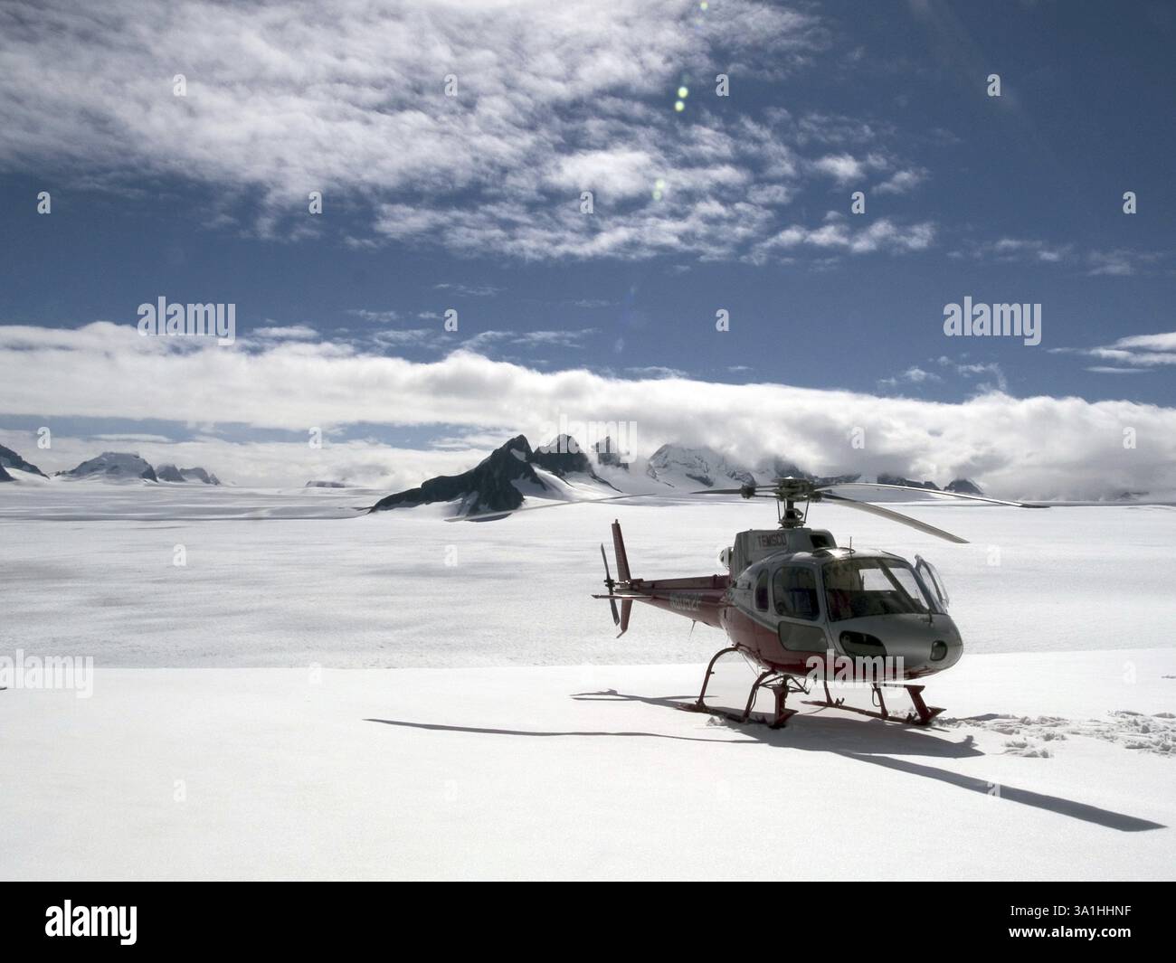 Helicopter landing on the juneau ice fields, alaska, U.S.A United ...