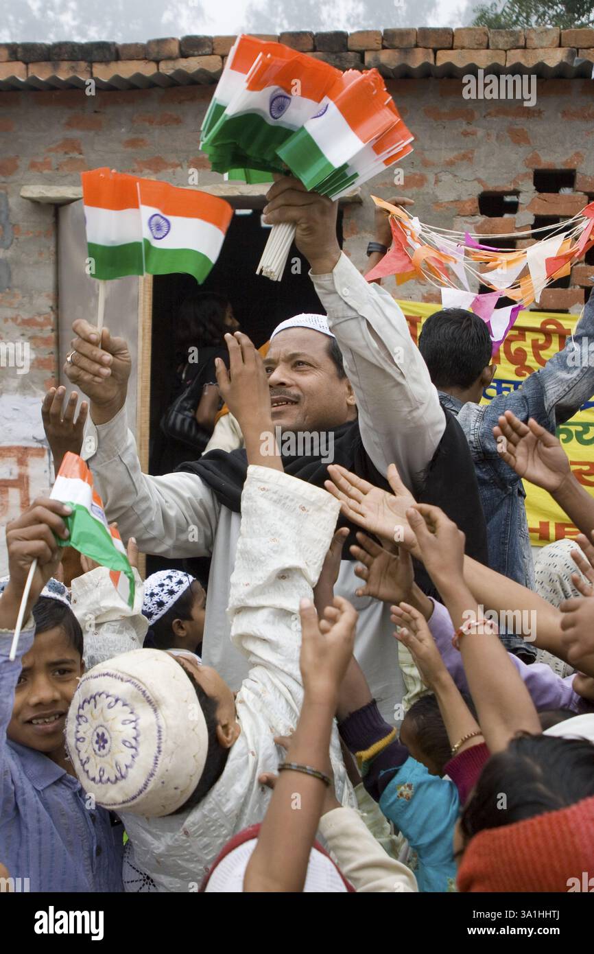 Muslim man distributing Indian flag to school children on republic day ...