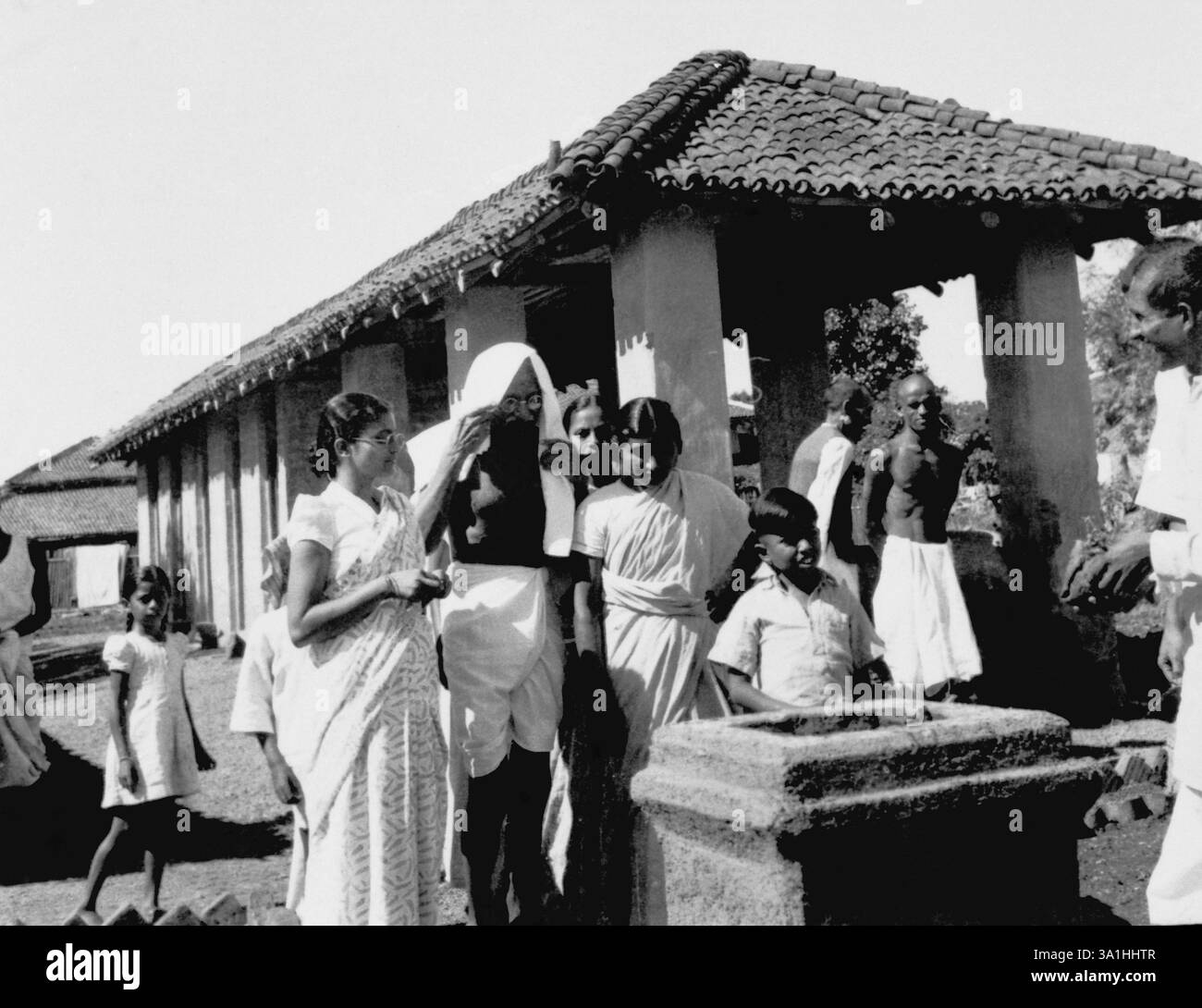 Mahatma Gandhi, Durga Mehta and others at a tulsi tree planting ...