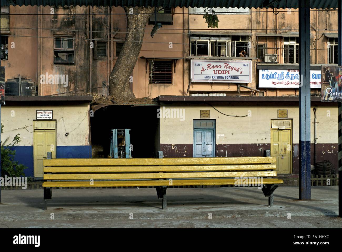 Yellow bench on Mumbai local railway station Matunga, Bombay Mumbai ...