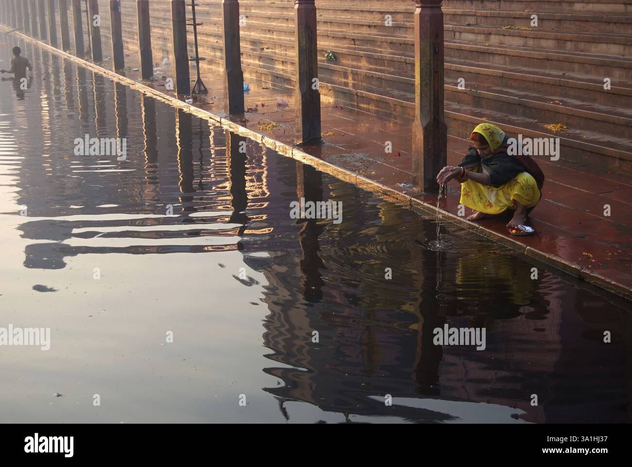 Woman offering oblation to river Yamuna, Mathura, Uttar Pradesh, India ...