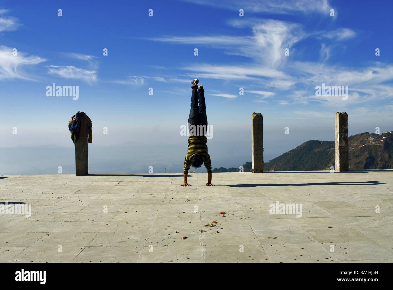 Indian acrobat doing handstand act, Mussoorie, Dehra Dun, Uttaranchal ...