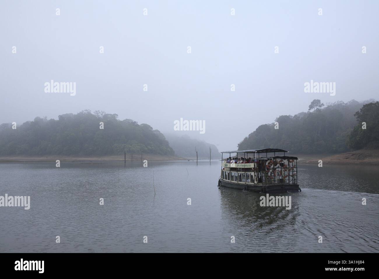 Early morning landscape of Periyar lake tourists on boat ride at ...