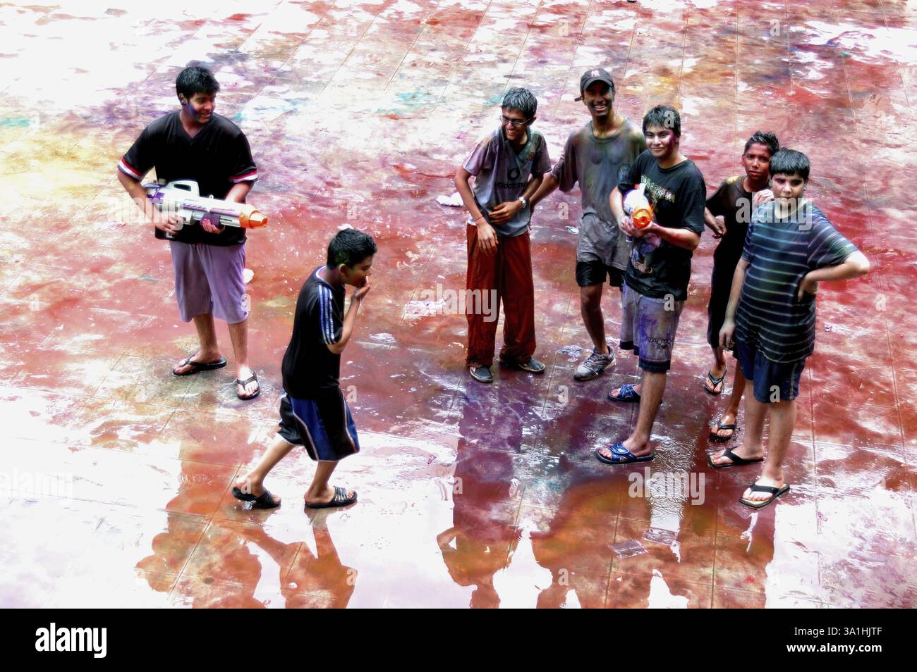 Seven children playing Holi festival of color at Ananta apartments at ...