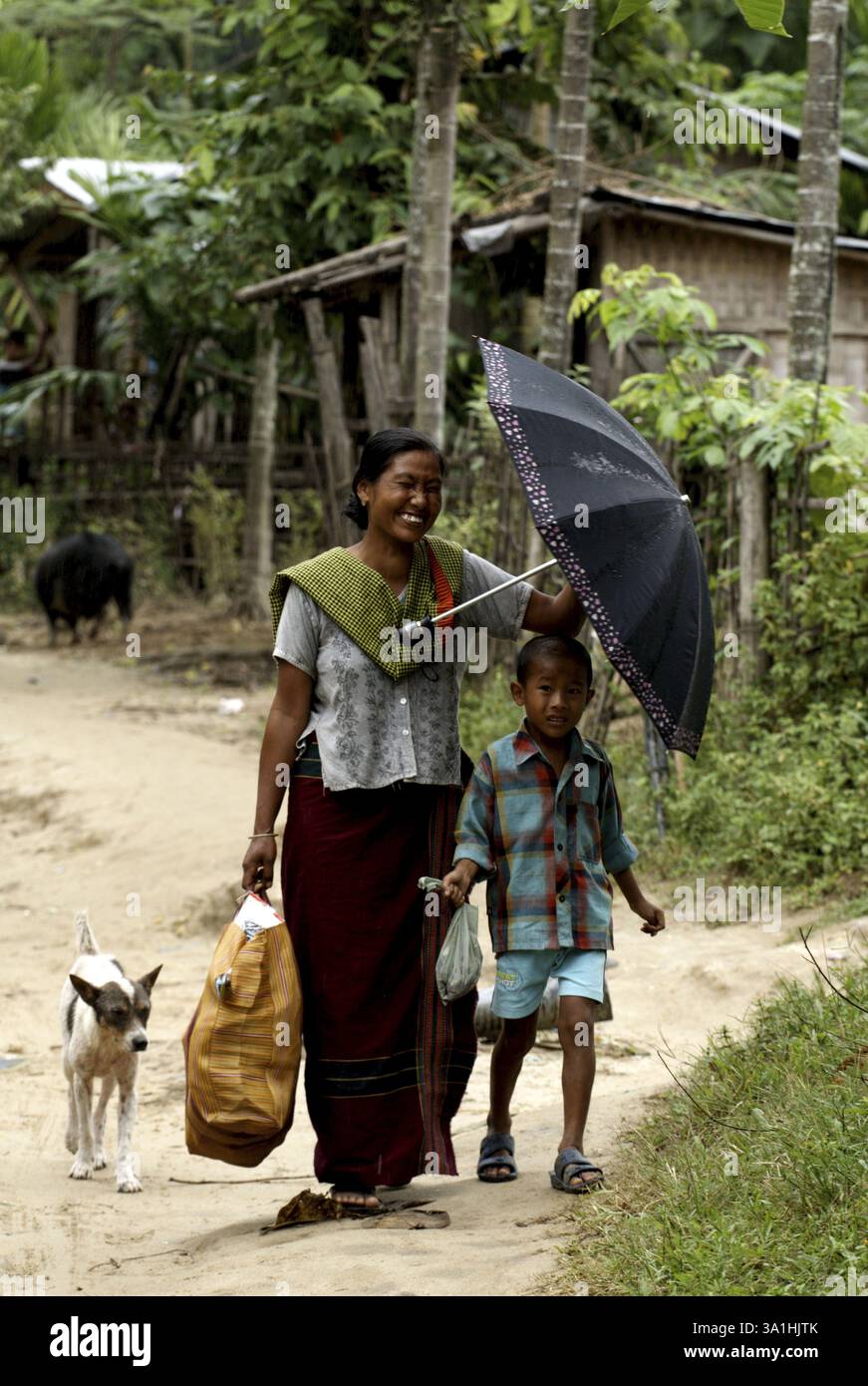 Boy walking with his mother, Diyun, Arunachal Pradesh, India, Asia ...