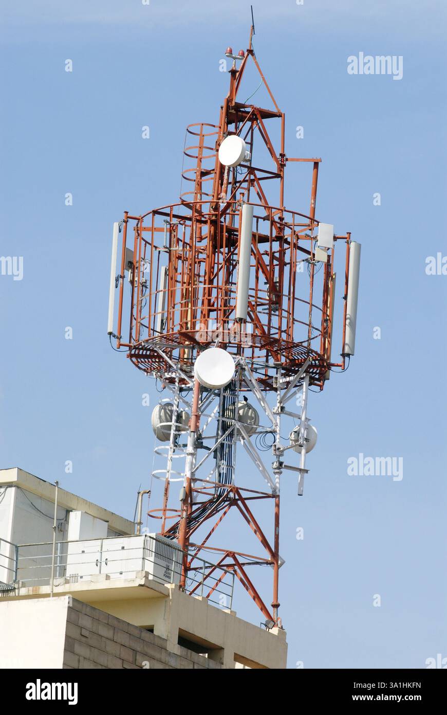 Microwave communication tower of mobile phone fixed on the terrace of ...