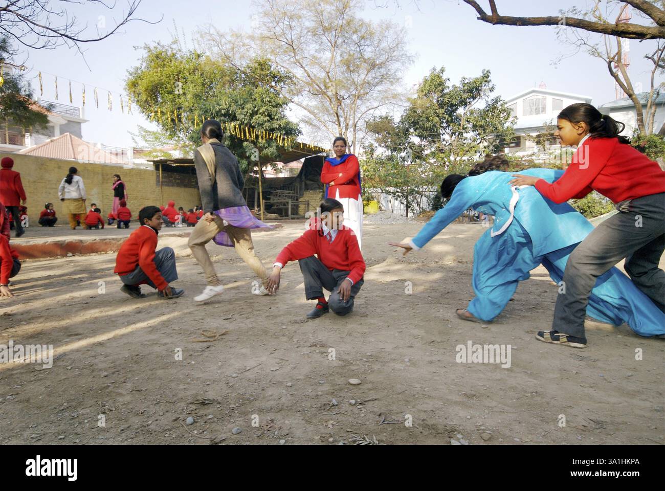 Students and teachers playing Kho Kho on the playground of Nanhi Duniya ...
