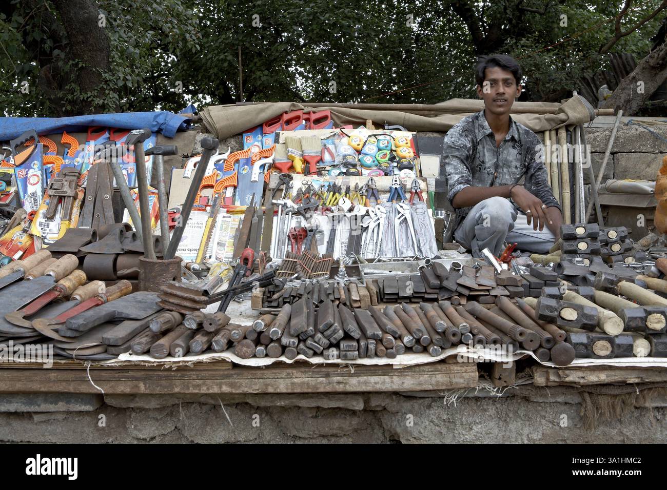 Display of all kinds of hardware tools on the roadside by a hawker ...