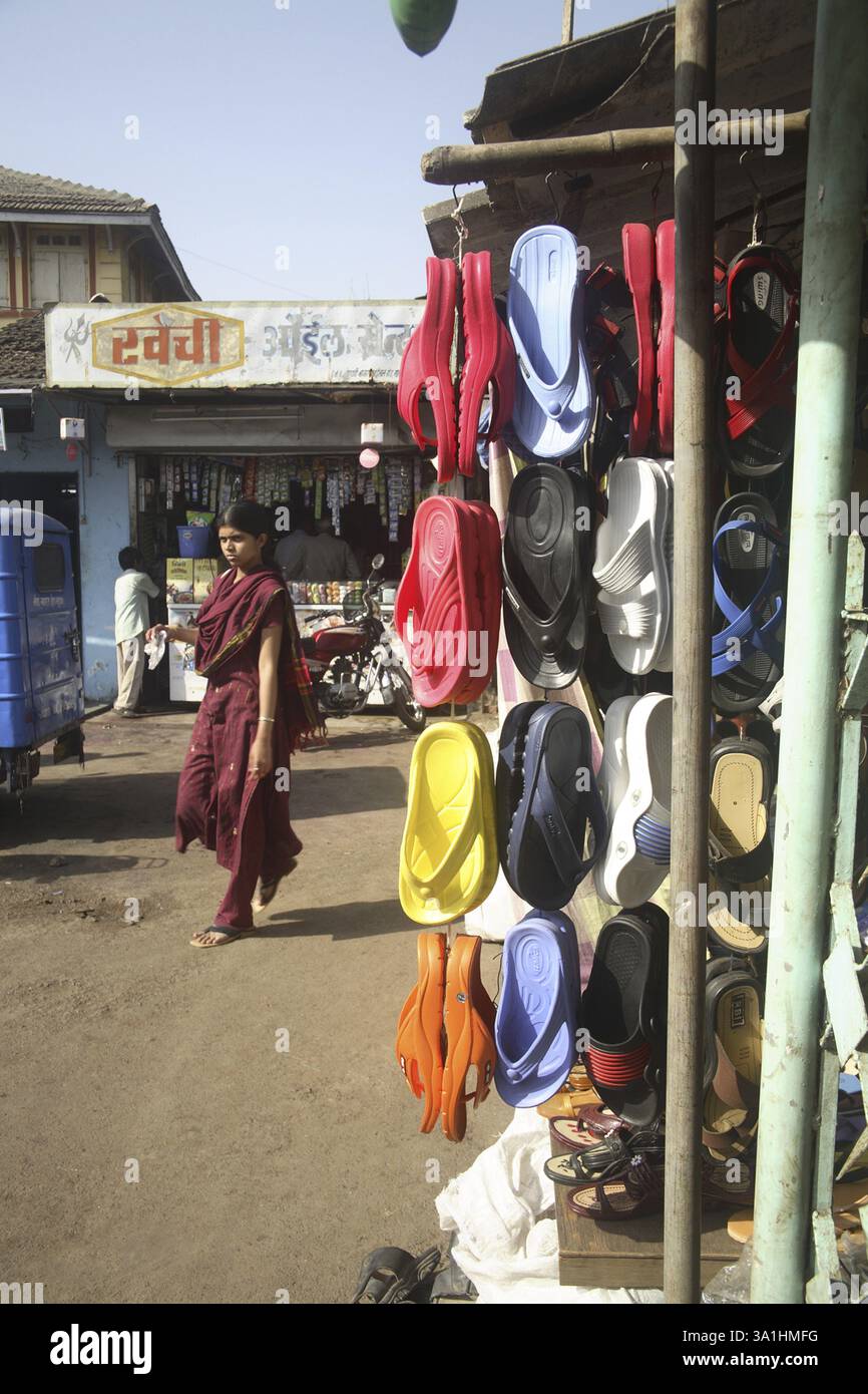 Indian market slippers for sale street scene in Somvari bazaar, Mulund ...