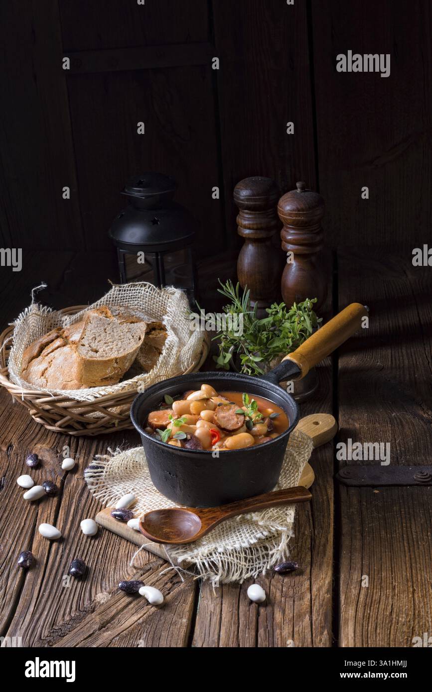 Polish baked beans with sausage Stock Photo - Alamy