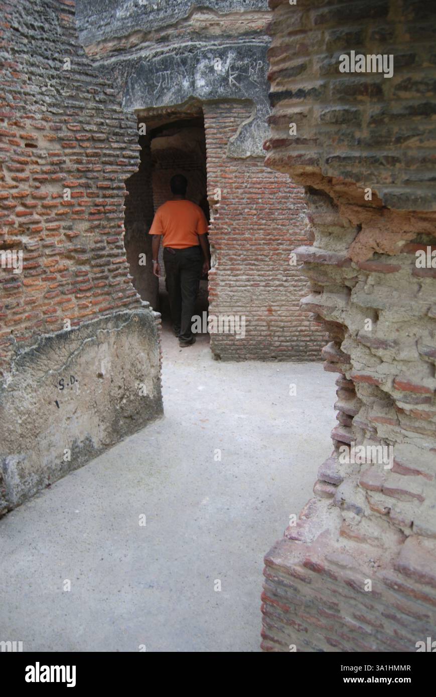 Man entering into gate of ruined rooms of residency, Lucknow, Uttar ...