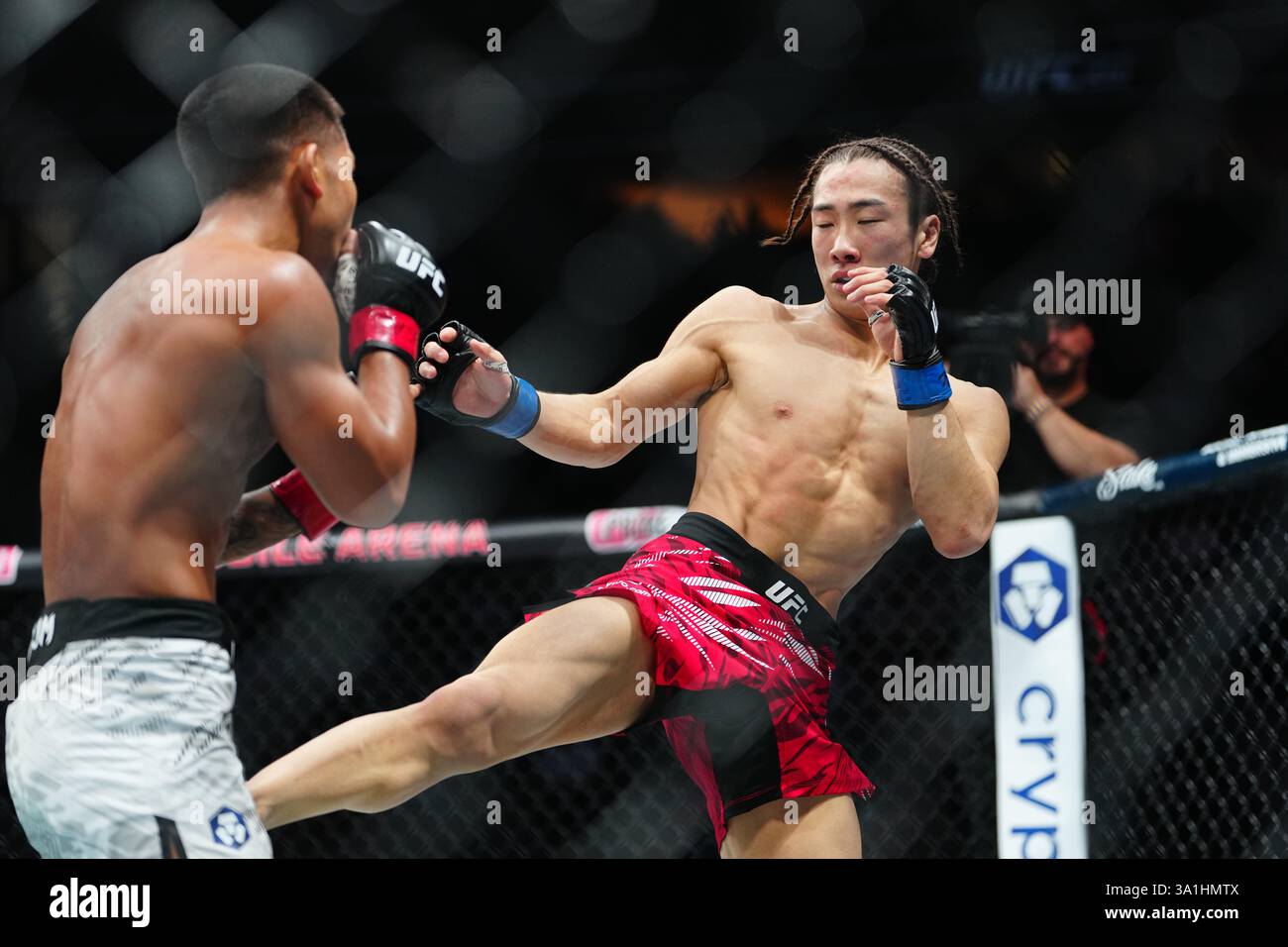LAS VEGAS, NV - MARCH 8:Joshua Van and Rei Tsuruya meet in the octagon ...