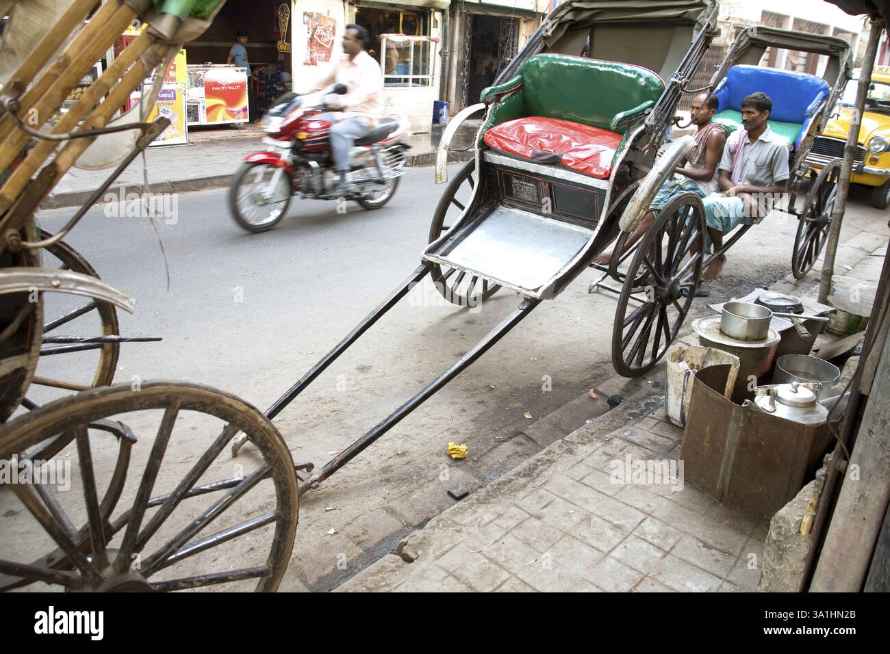 Empty hand rickshaw, manual labor rickshaw pullers resting in vehicles ...
