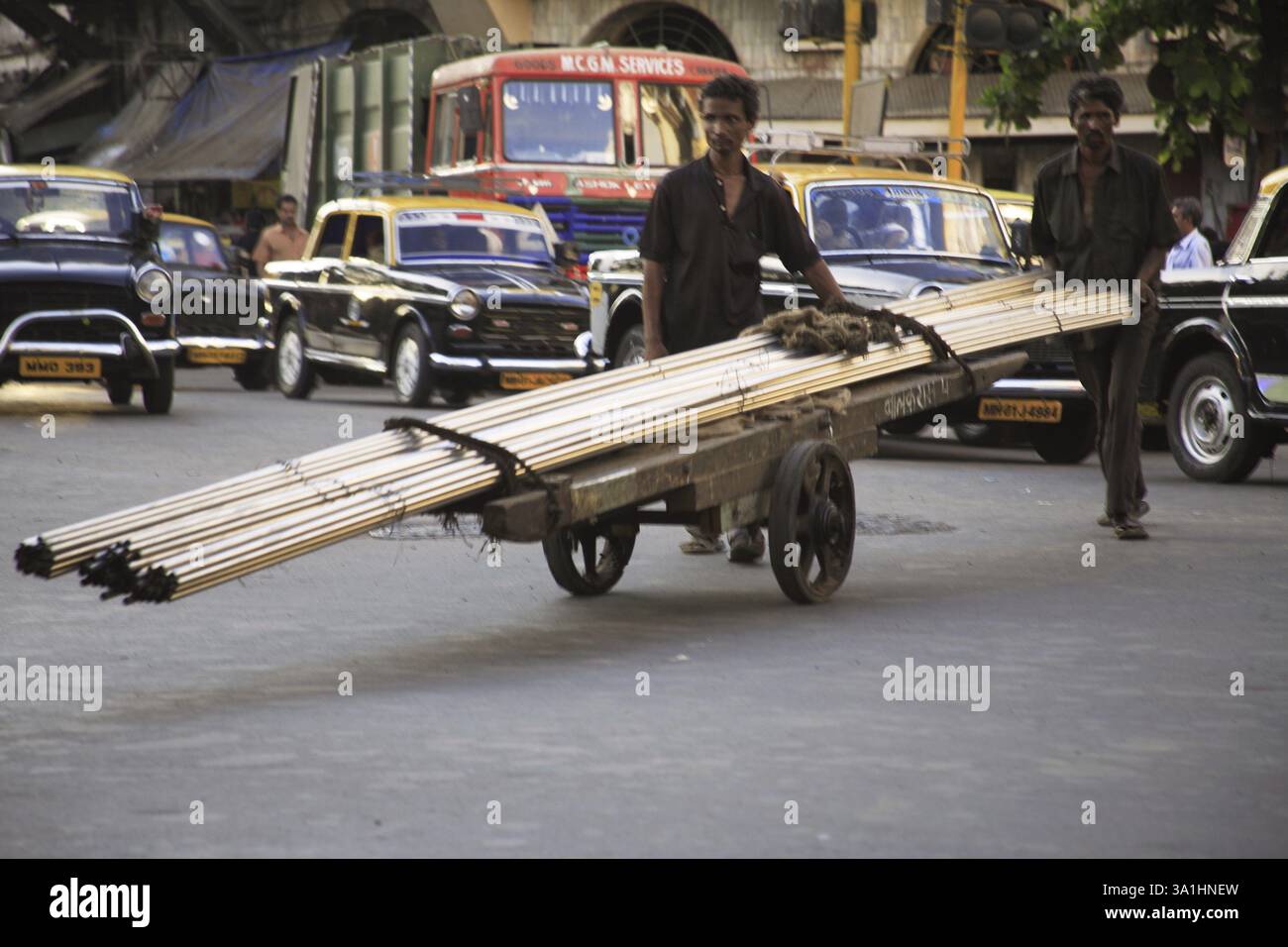 Man pulling hand cart, Sardar Vallabhbhai Patel road, Grant road ...