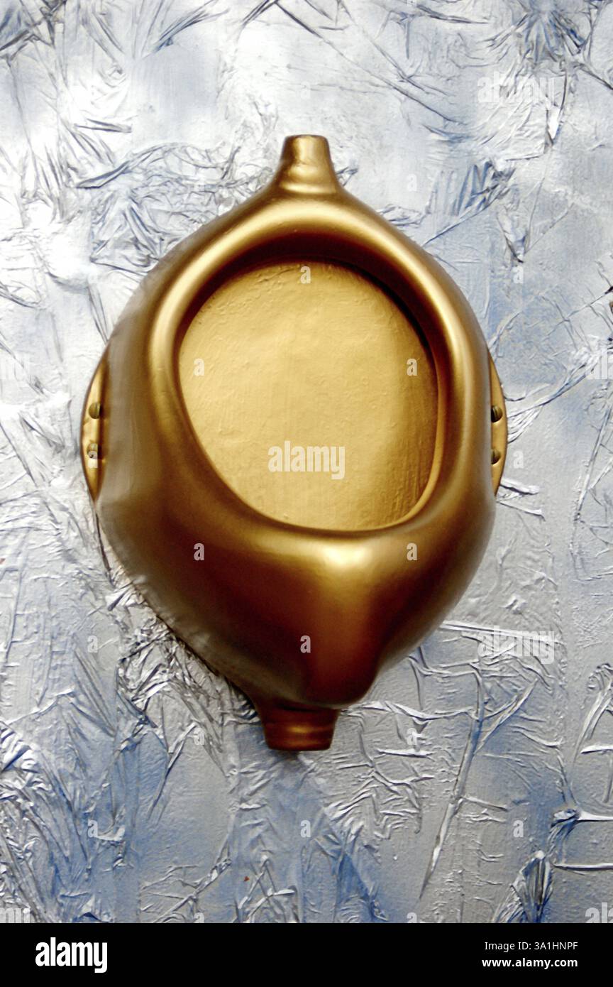 Male urinal pot in golden color as art piece in Kalaghoda festival 2006 ...