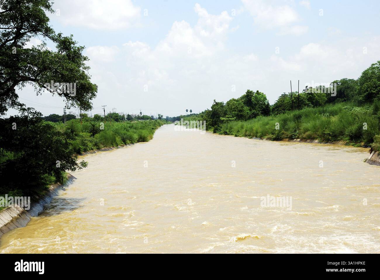 Muddy river water flowing Stock Photo - Alamy