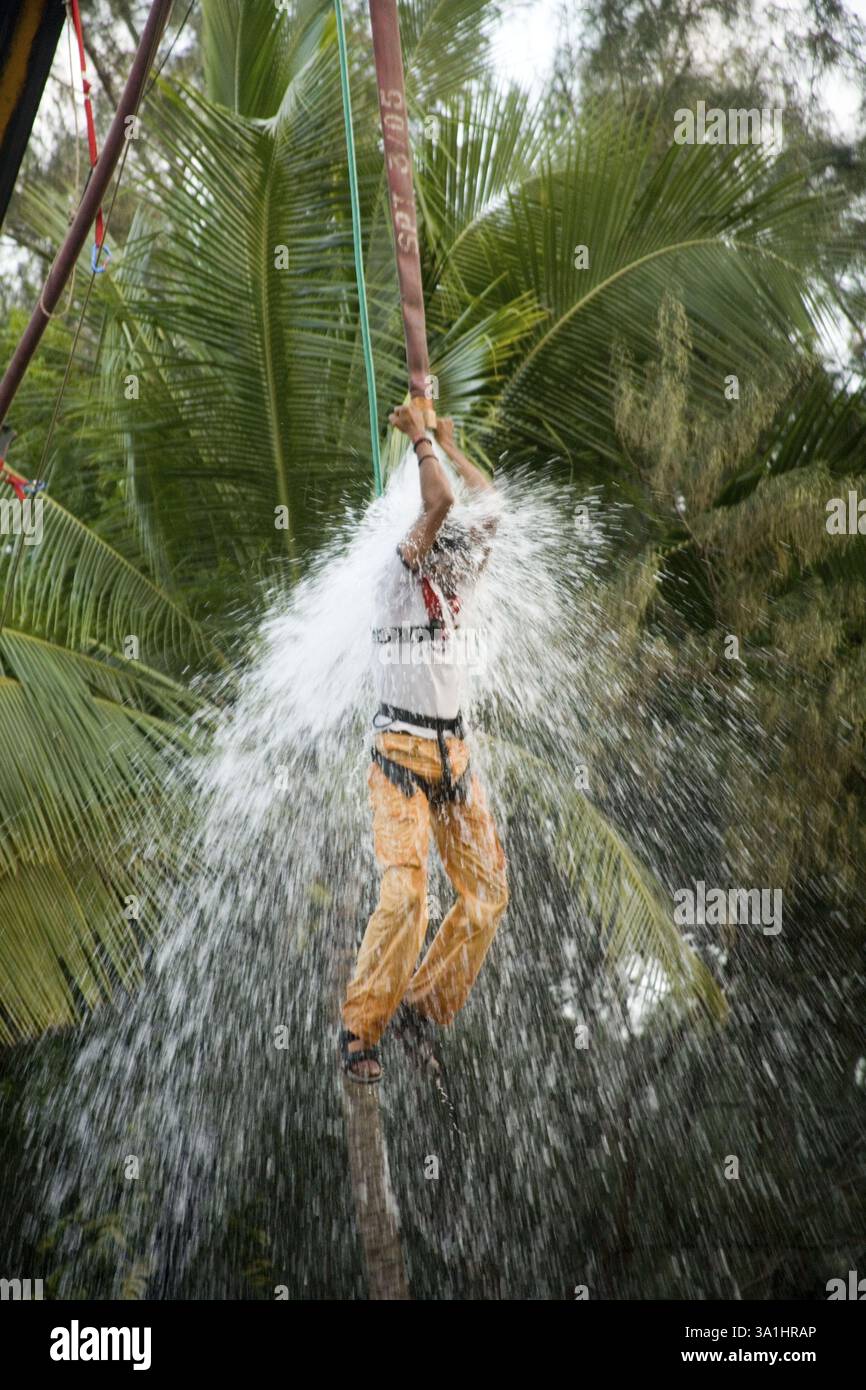 Adventure game, man hanging with water pipe, India, Asia Stock Photo ...