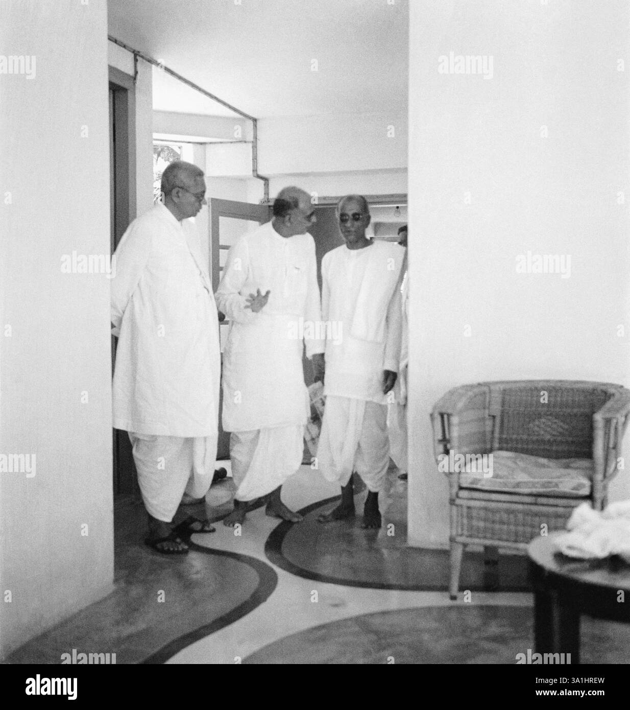 Mahadev Desai speaking with Chakravarti Rajagopalachari at Birla House ...