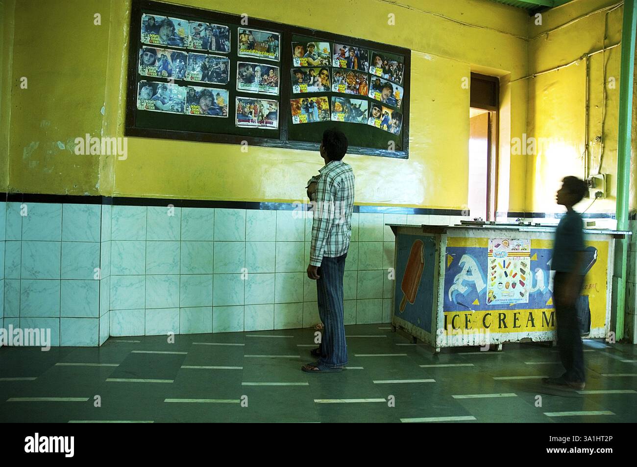Children admiring Bollywood film poster at Royal talkies, Grant Road ...