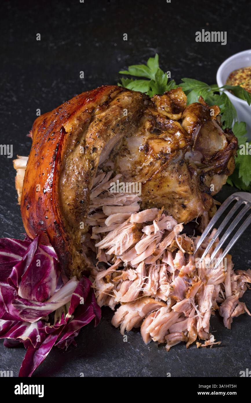 Roasted lamb knuckle served hi-res stock photography and images - Alamy