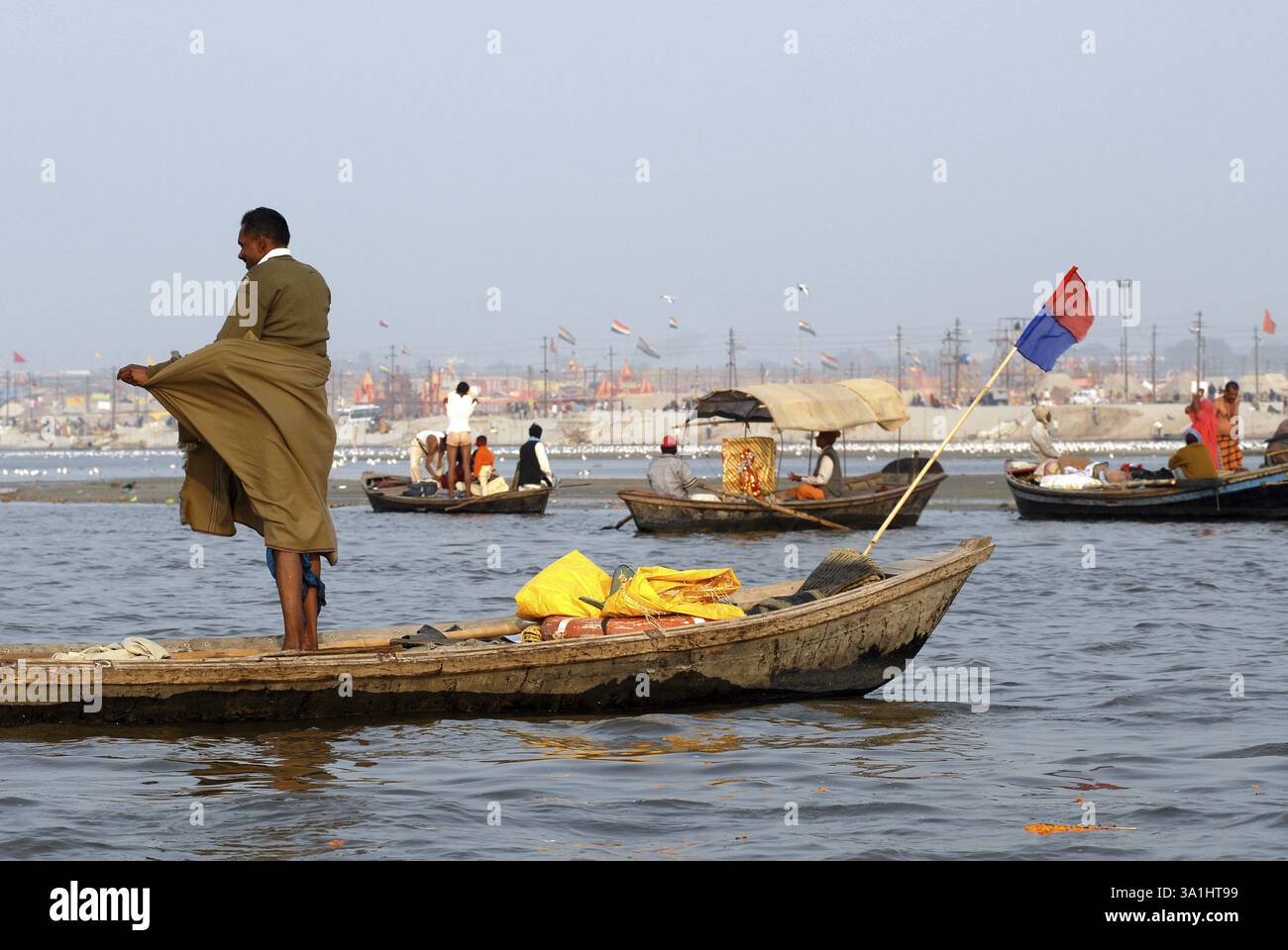 Boats ferry devotees at the confluence of the Ganges, Yamuna the ...