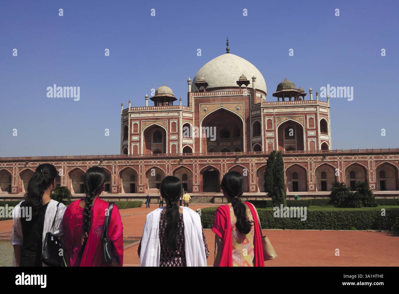 Indian girls watching Humayun's tomb built in 1570 made from red ...