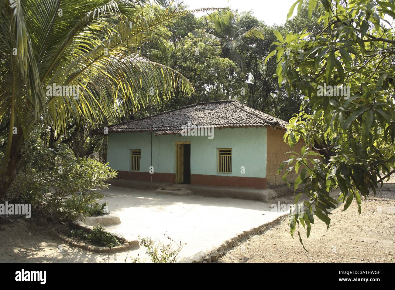 House made of mud and painted roof made of tiles in village of ...