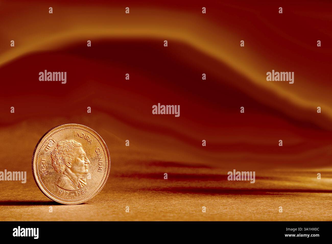 One single Indian currency five rupees coin and artistic background ...