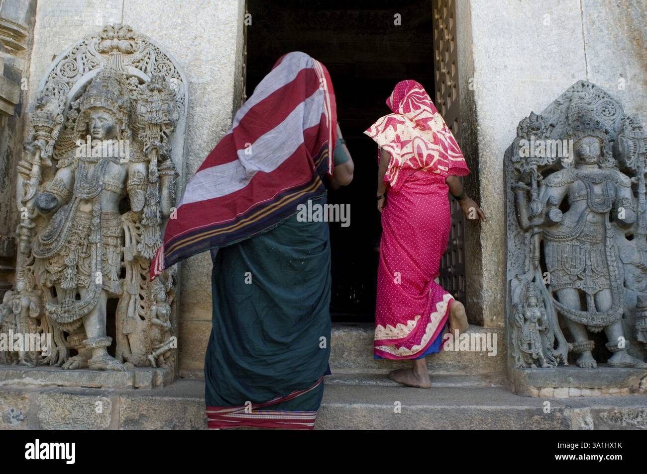 Women entering in temple Stock Photo - Alamy
