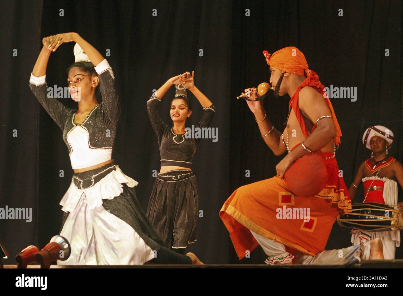 Cobra dance, depicts the movements of the cobra and the taming of it by ...